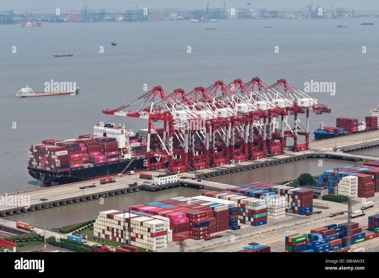 SHANGHAI, CHINA - JUNE 9, 2025 - A cargo ship is loading and unloading ...