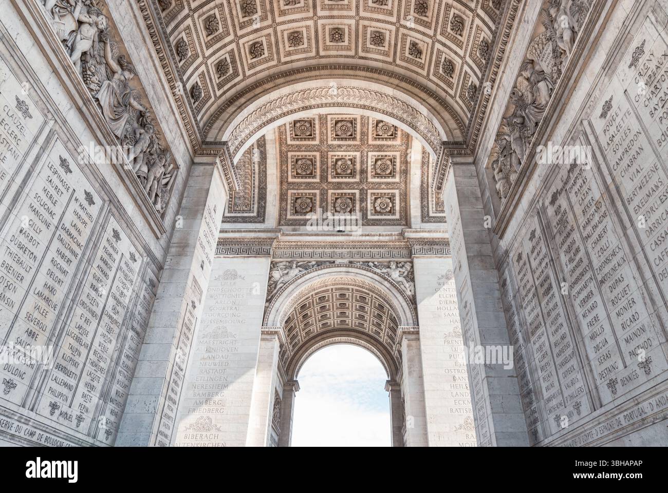 France, Paris - May 03, 2025 - The magnificent details of ornate stone carvings under the arch ...
