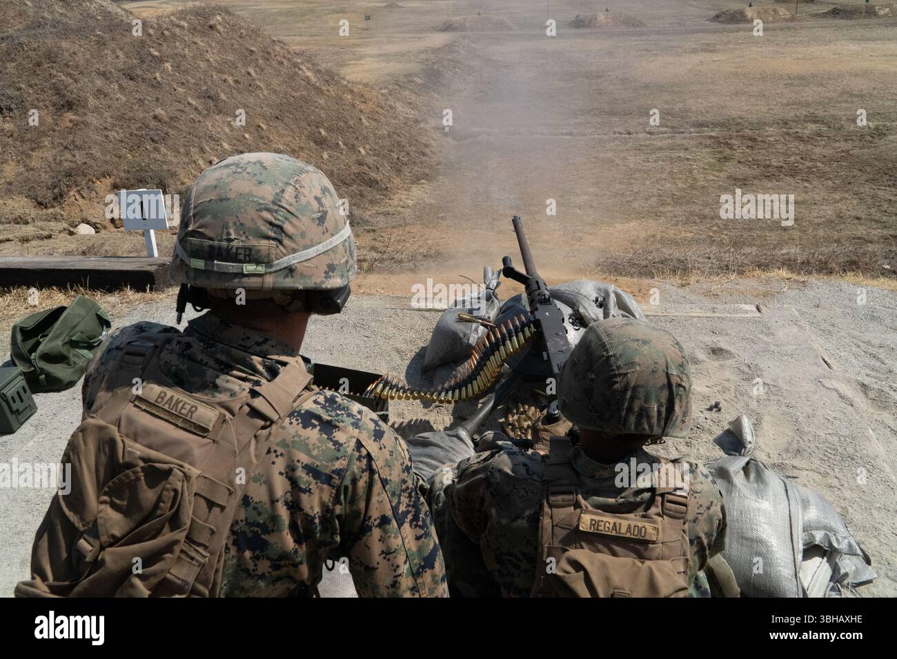 U.S. Marine Corps Cpl. Adam Baker, left, and Lance Cpl. Jose Regalado ...