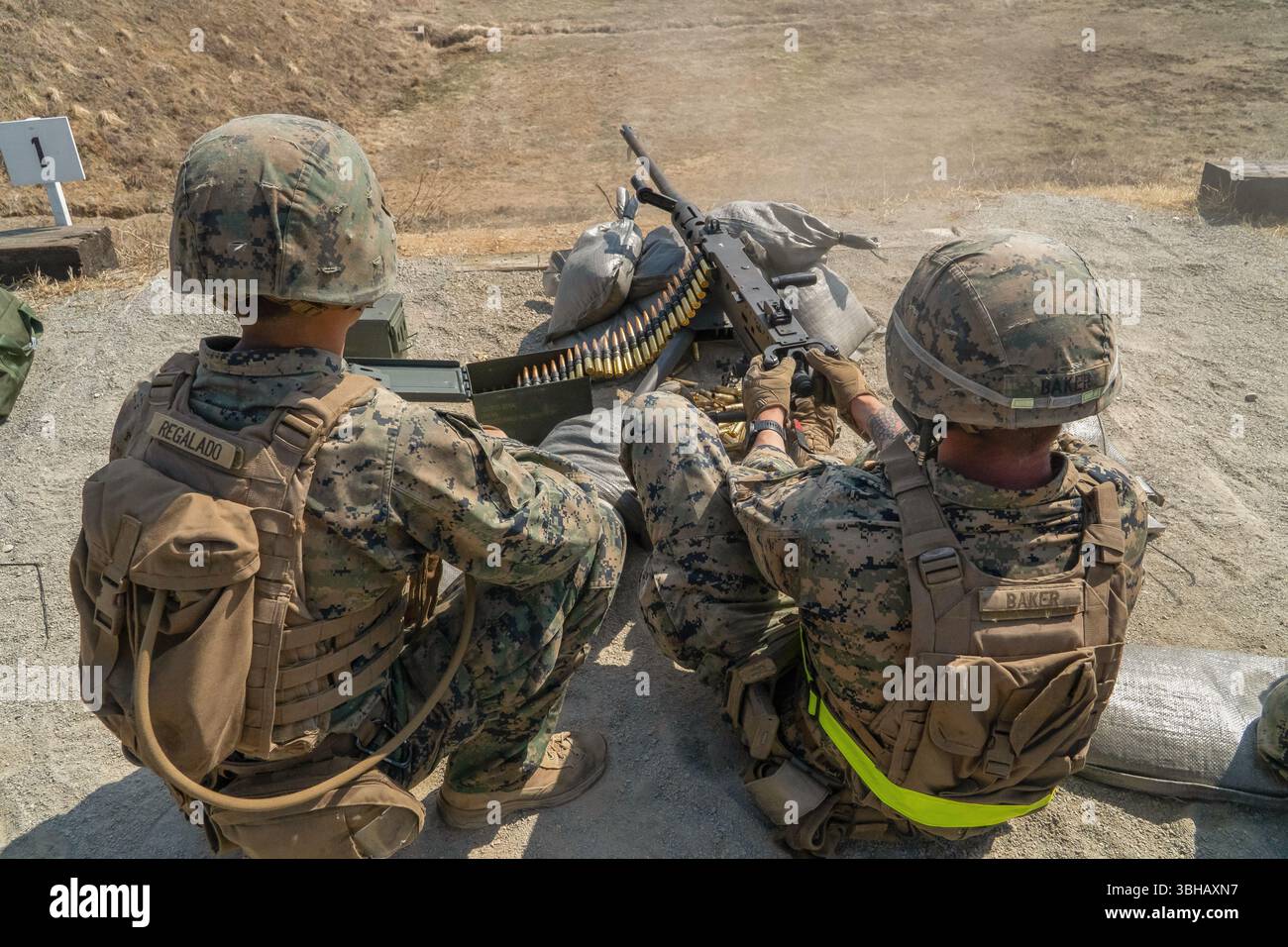 U.S. Marine Corps Cpl. Adam Baker, right, and Lance Cpl. Jose Regalado ...