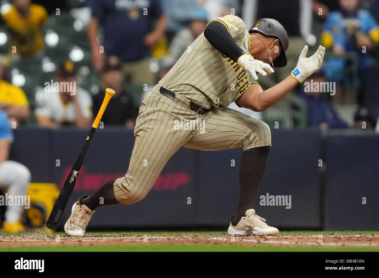 San Diego Padres' Xander Bogaerts ducks to avoid being hit by a pitch ...