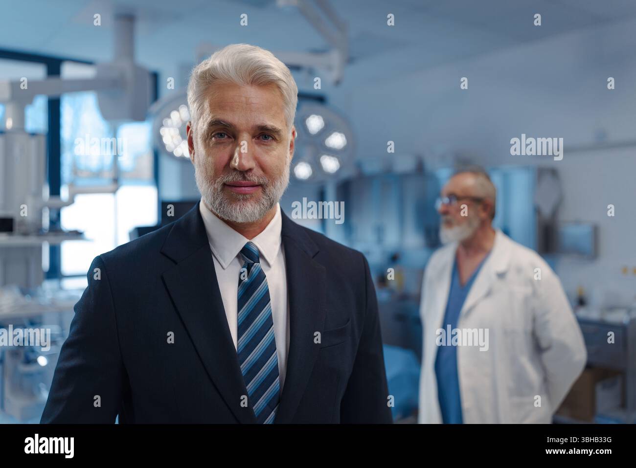 Portrait of pharmaceutical sales representative with doctor standing ...
