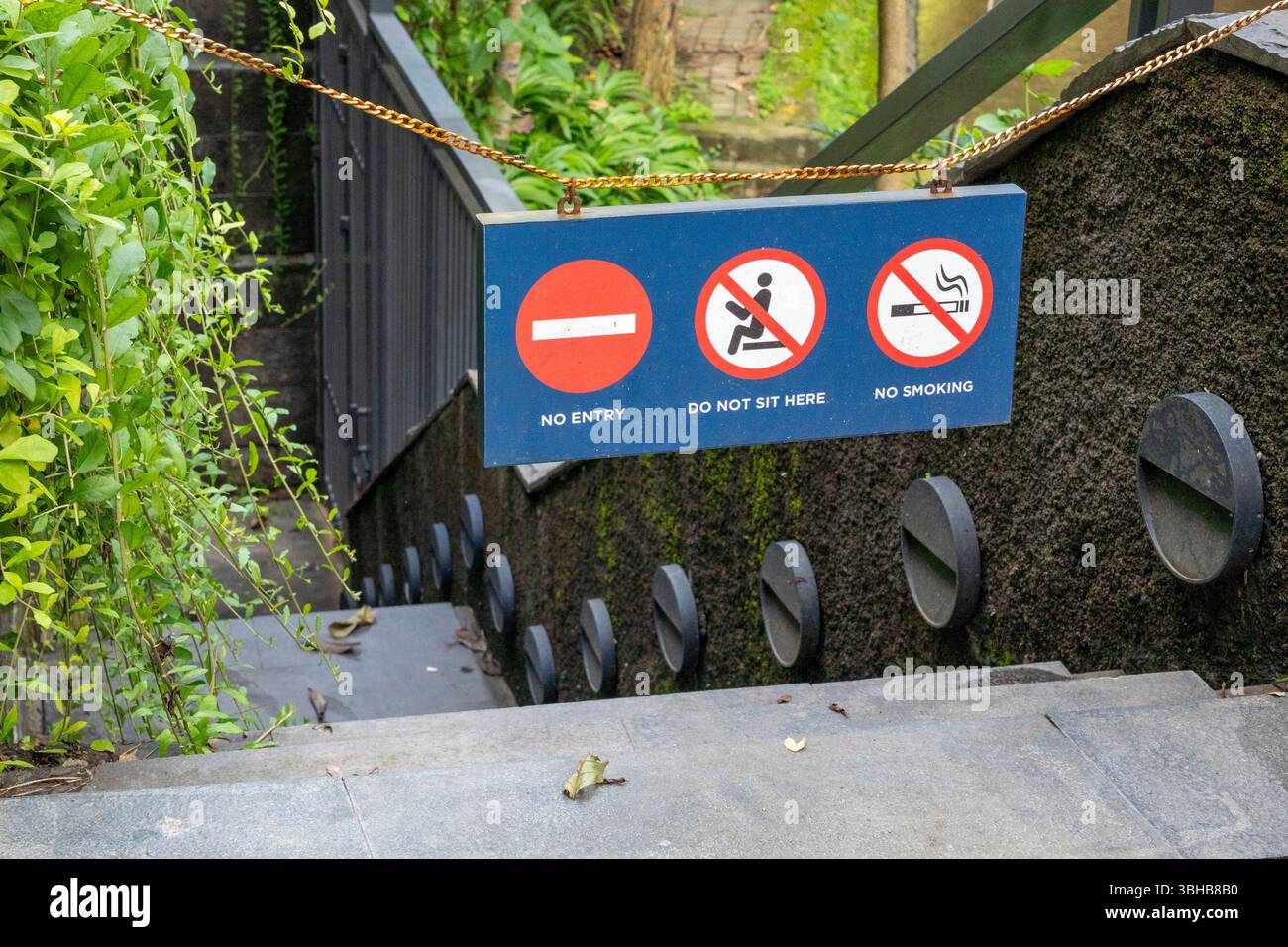 Large red and white sign with a black border that says "Do Not Enter ...