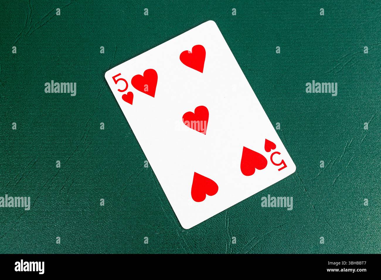 Five of Hearts Playing Card on Green Surface – Poker and Casino Concept ...