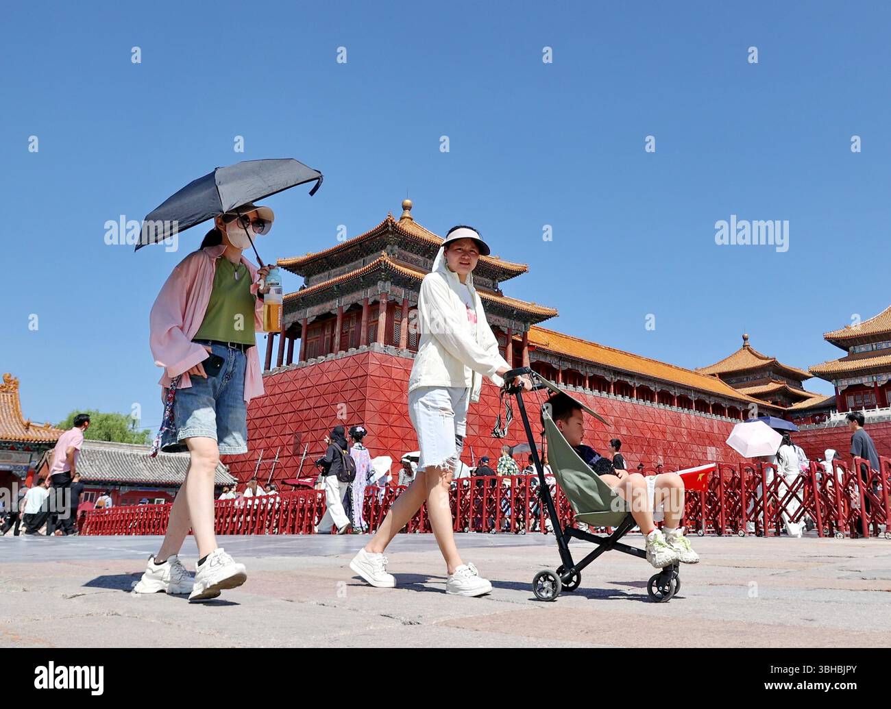 Tourists visit the Palace Museum amid hot weather in Beijing, China, 6 ...
