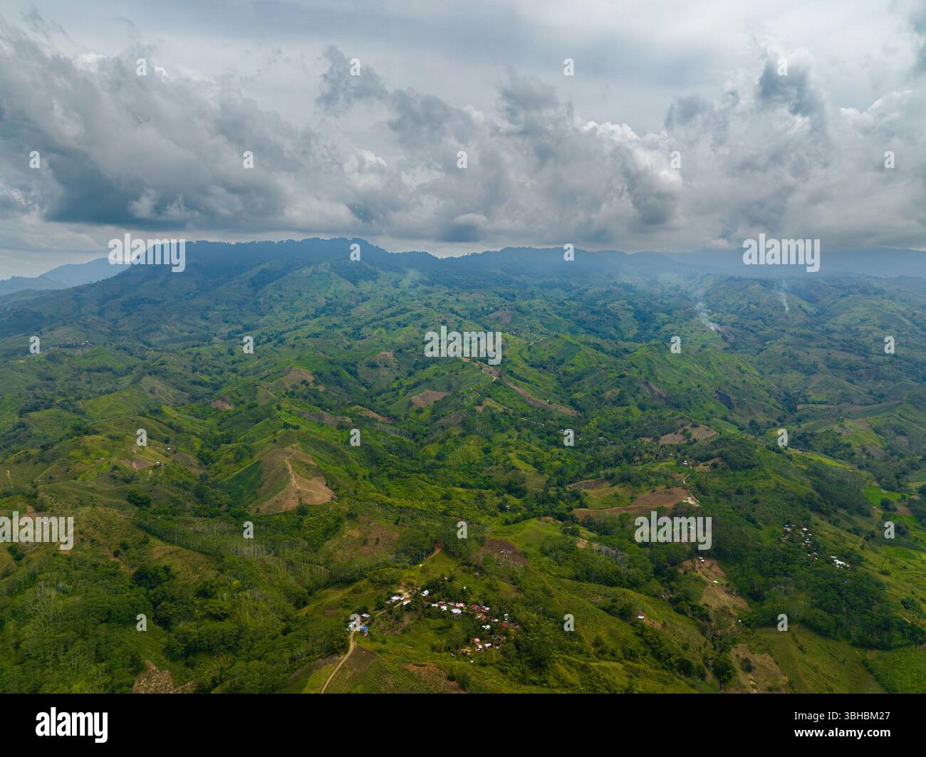 Aerial drone of Mountain slopes with rainforest and a mountain valley ...