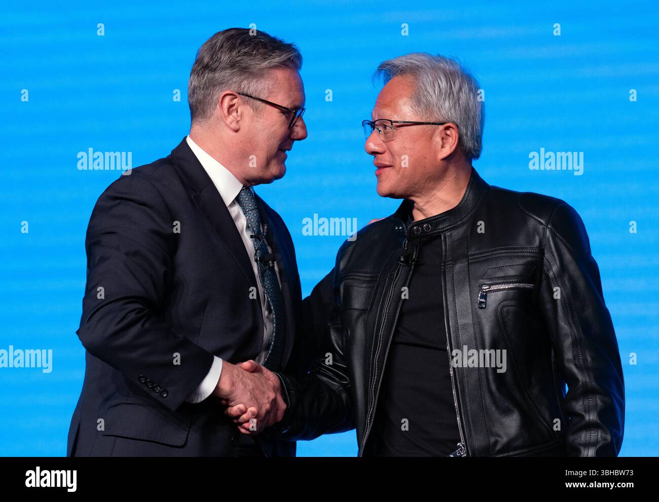 Prime Minister Sir Keir Starmer (left) shakes hands with Jensen Huang ...