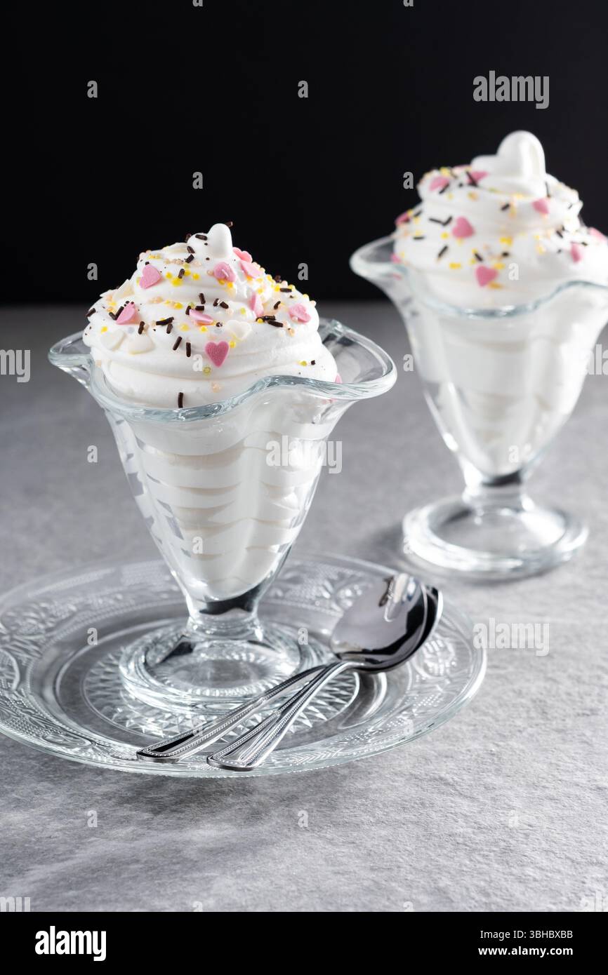 Whipped Cream Delight with Sprinkles on gray background Stock Photo - Alamy