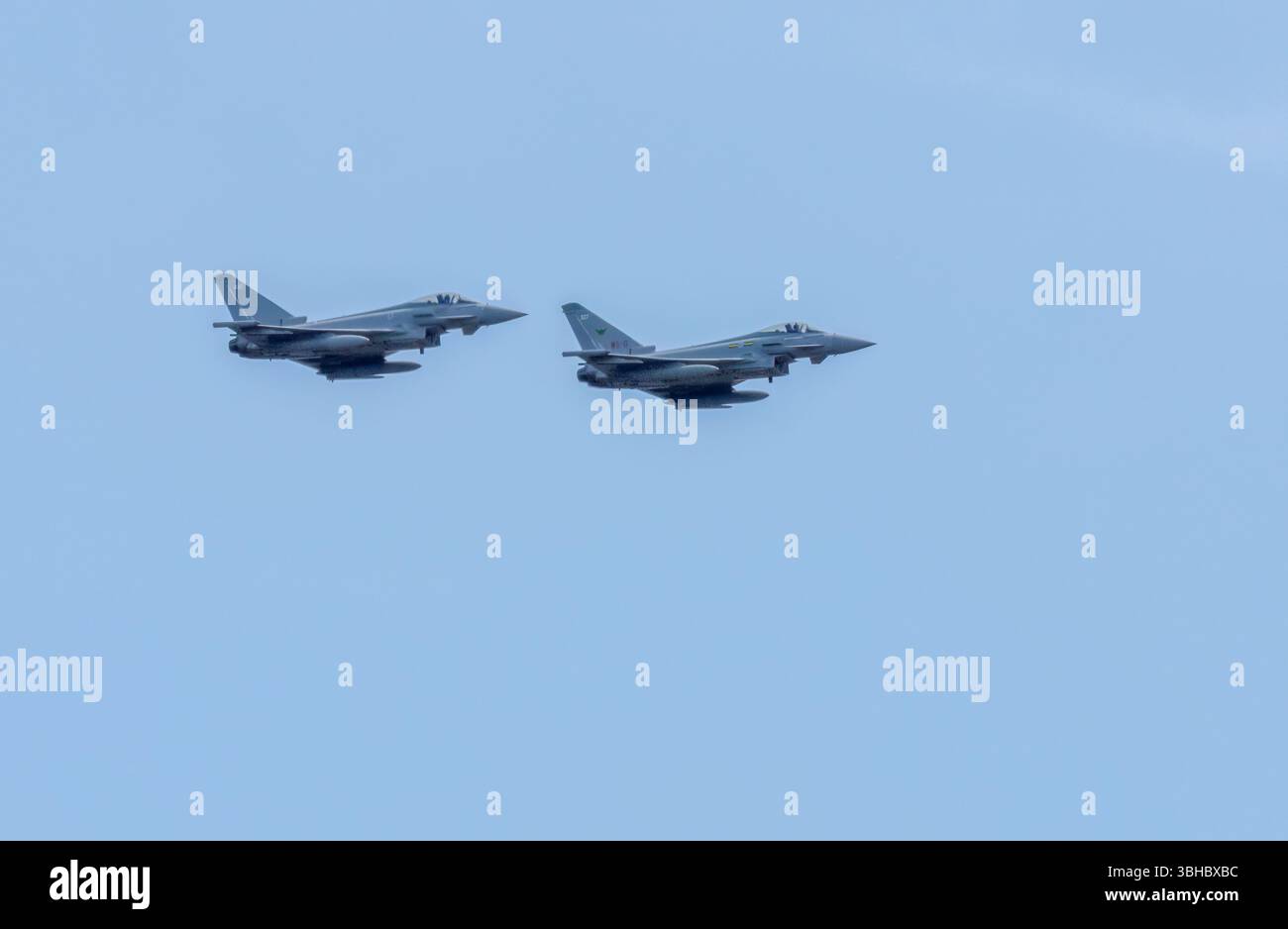 Typhoon fighter jets coming in to land at RAF Lossiemouth Stock Photo ...