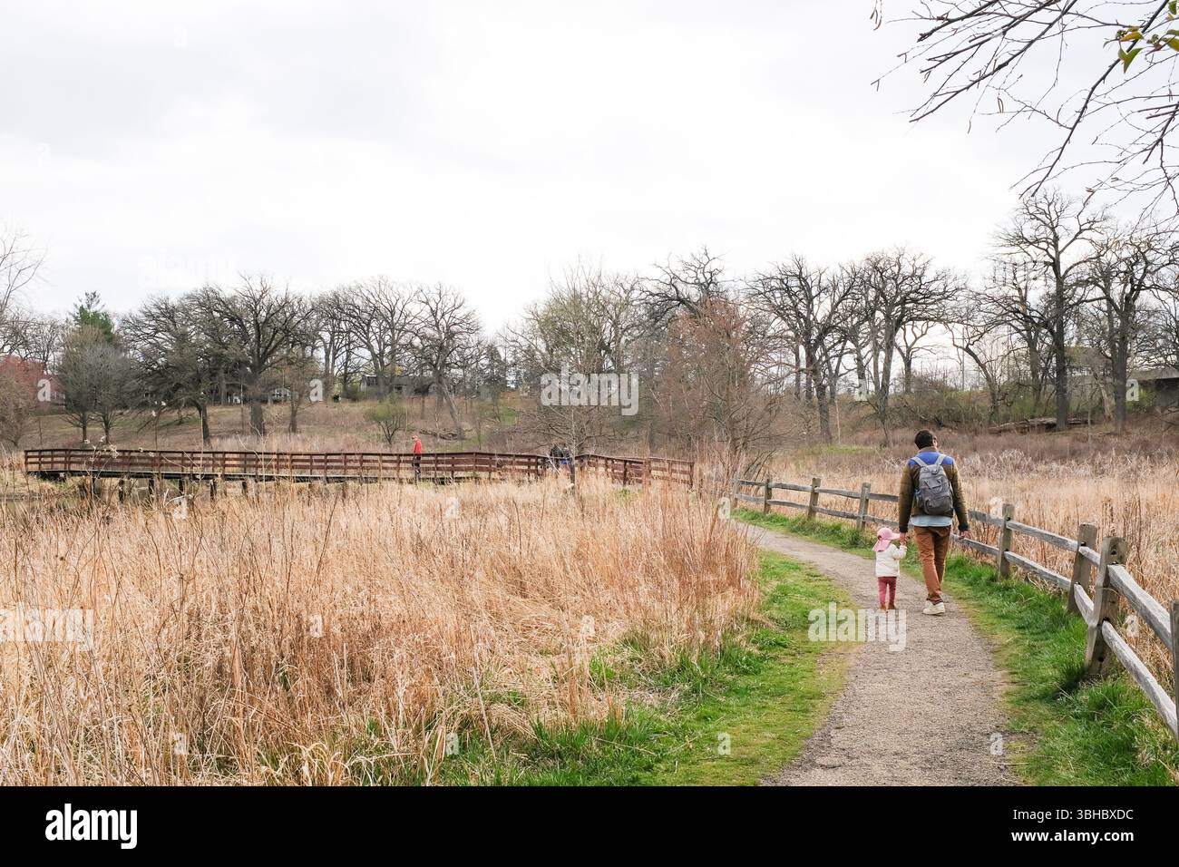 Father and Daughter Walking Together Down Nature Path Stock Photo - Alamy