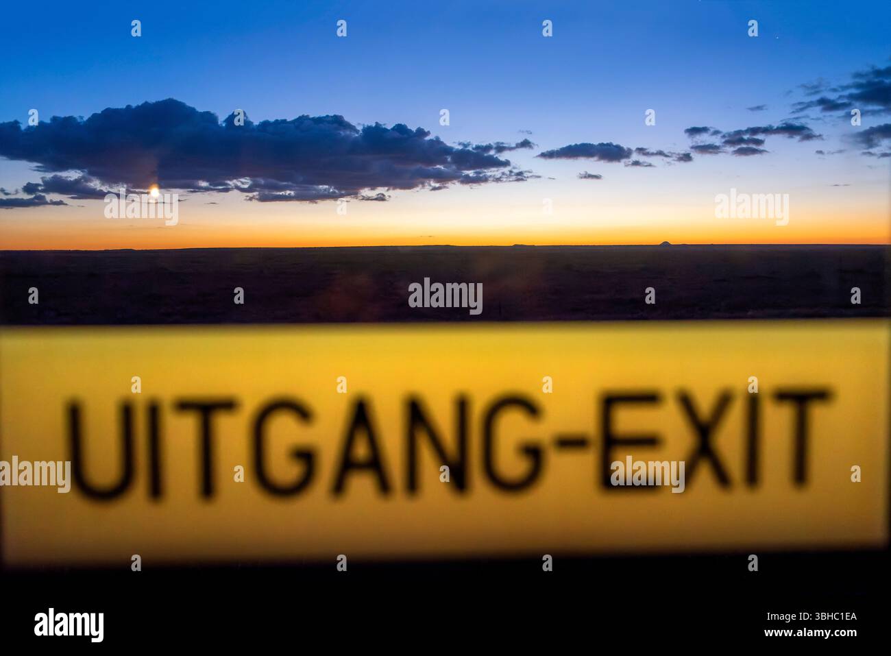 Exit sign in dutch in the metrorail train on the way, between Cape Town ...