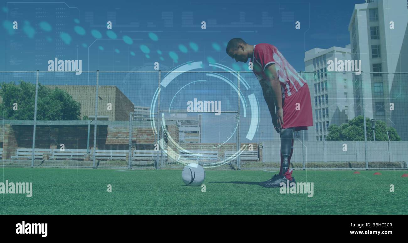 Leaning forward soccer player preparing kick on turf field, with ball ...