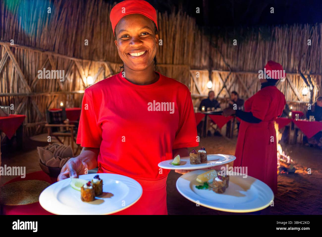 Waiters in Night dinner wiht fire at the restaurant in Mala Mala Game ...