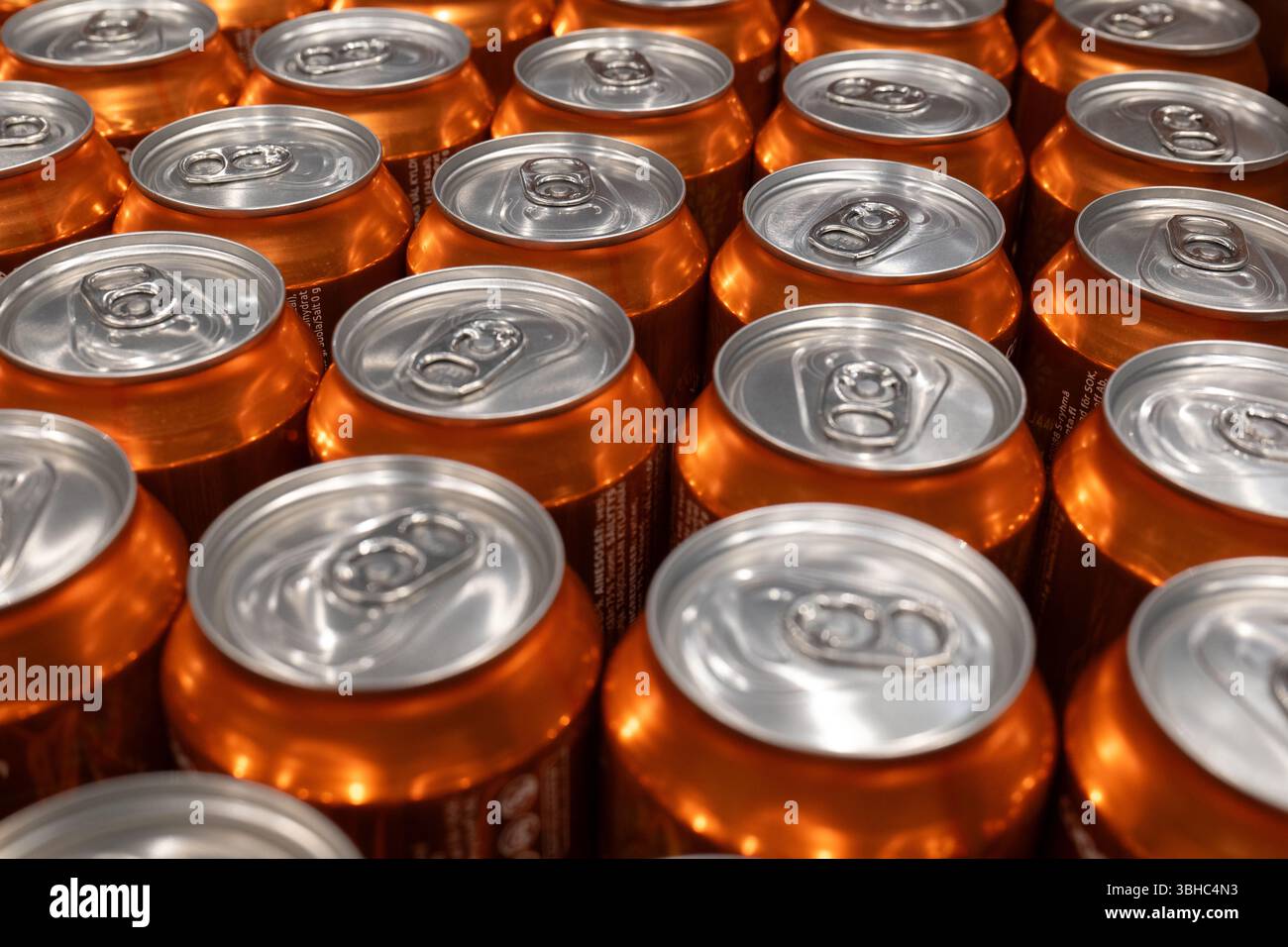 Rows of Shiny Orange Soda Cans Stock Photo - Alamy