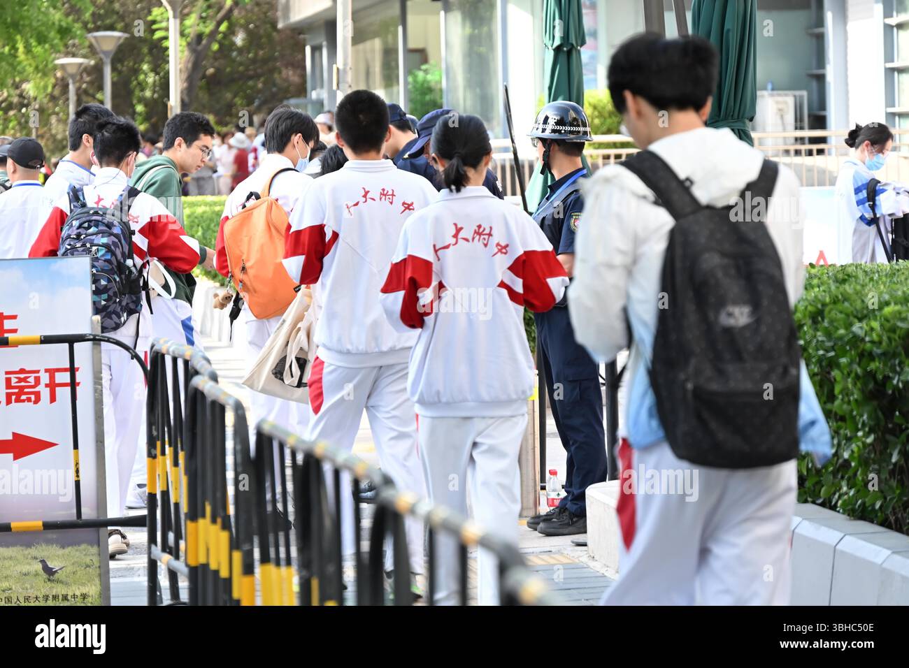 Candidates enter an examination site in Beijing, China, 7 June, 2025 ...