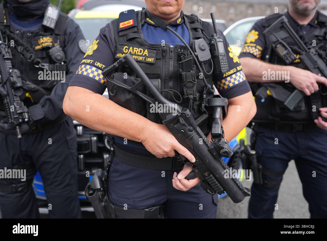 A member of the armed support unit holding a 40mm less lethal ...
