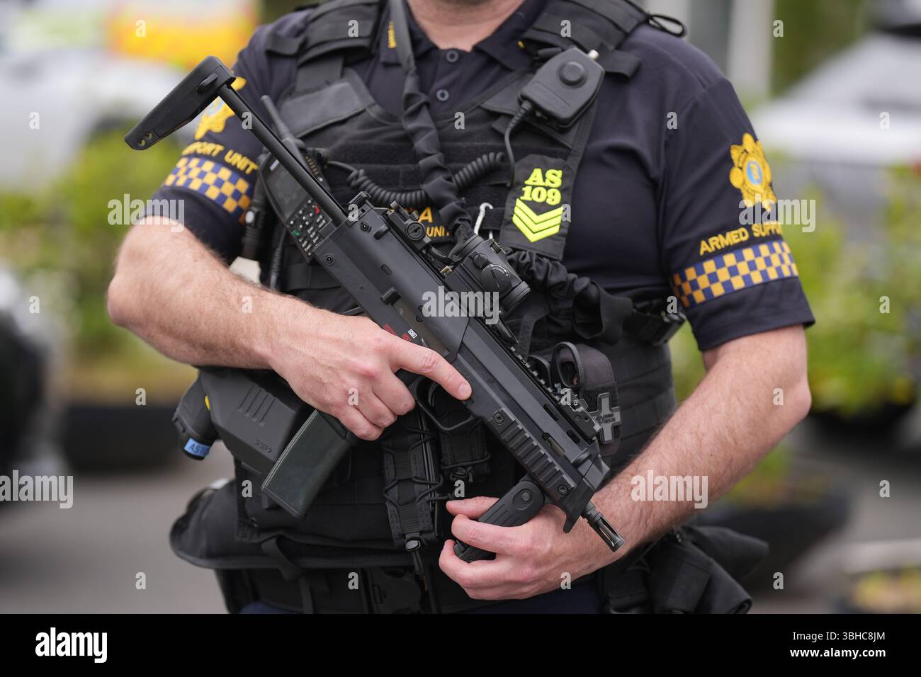 A member of the armed support unit holding a MP7 sub-machine gun at the ...