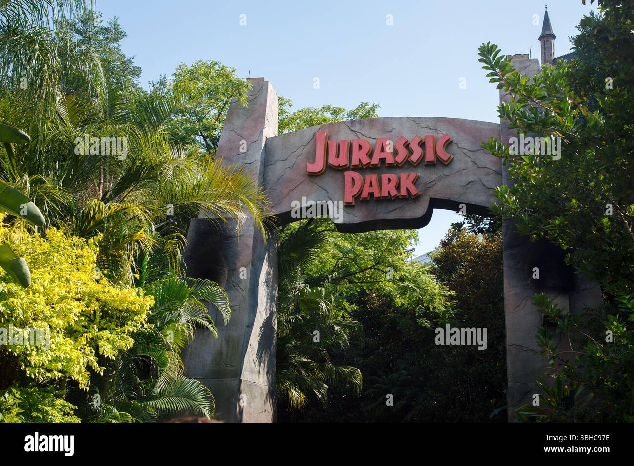 The Jurassic Park entrance gate in Island of Adventure amusement park ...