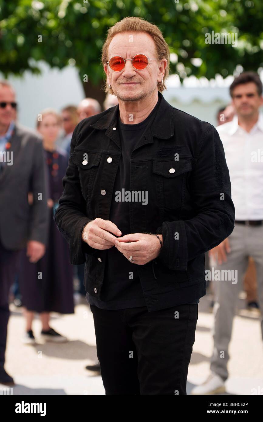 Bono poses for photographers at the photo call for the film 'Bono ...