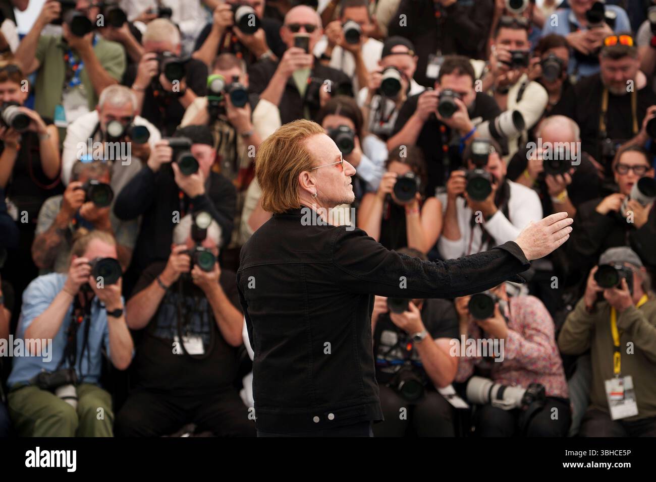 Bono poses for photographers at the photo call for the film 'Bono ...