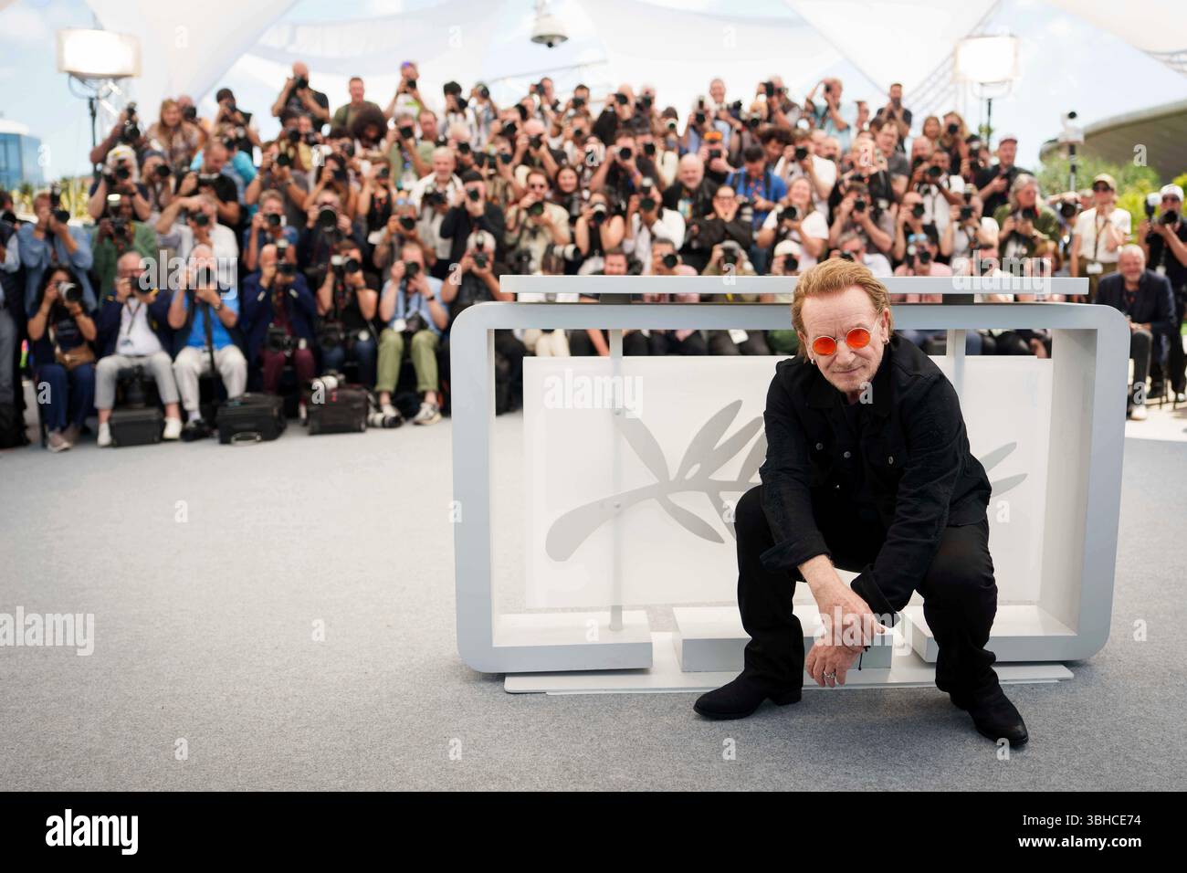 Bono poses for photographers at the photo call for the film 'Bono ...