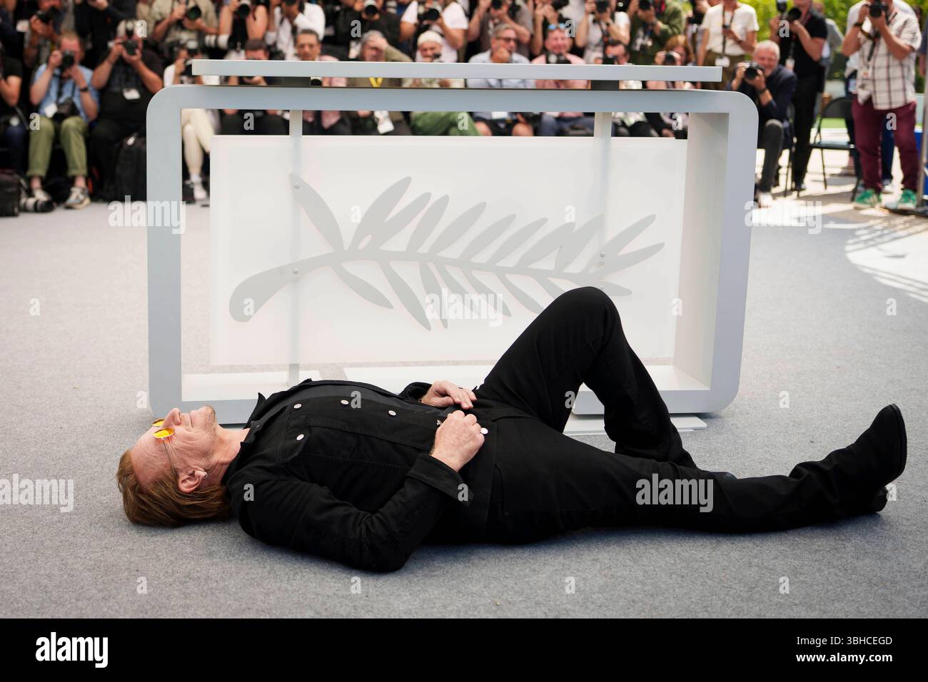 Bono poses for photographers at the photo call for the film 'Bono ...