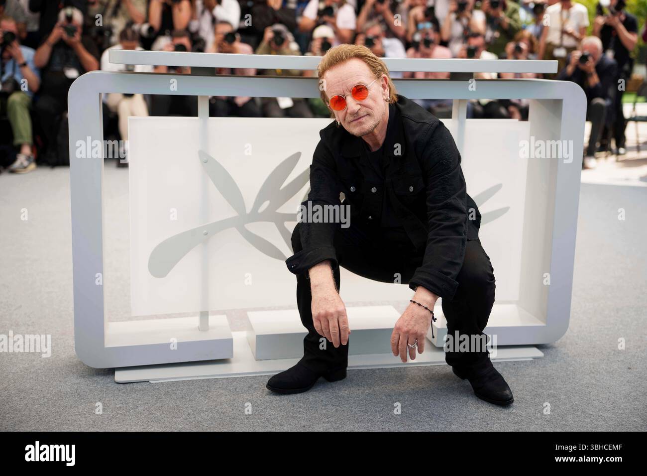 Bono poses for photographers at the photo call for the film 'Bono ...