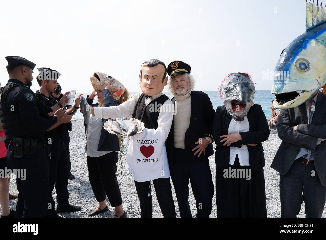 Activists from Ocean Rebellion stage a street theatre protest in Nice ...