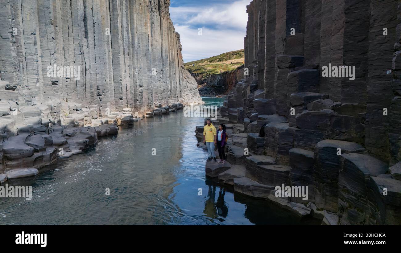 A couple explore the stunning rock formations and crystal-clear waters ...