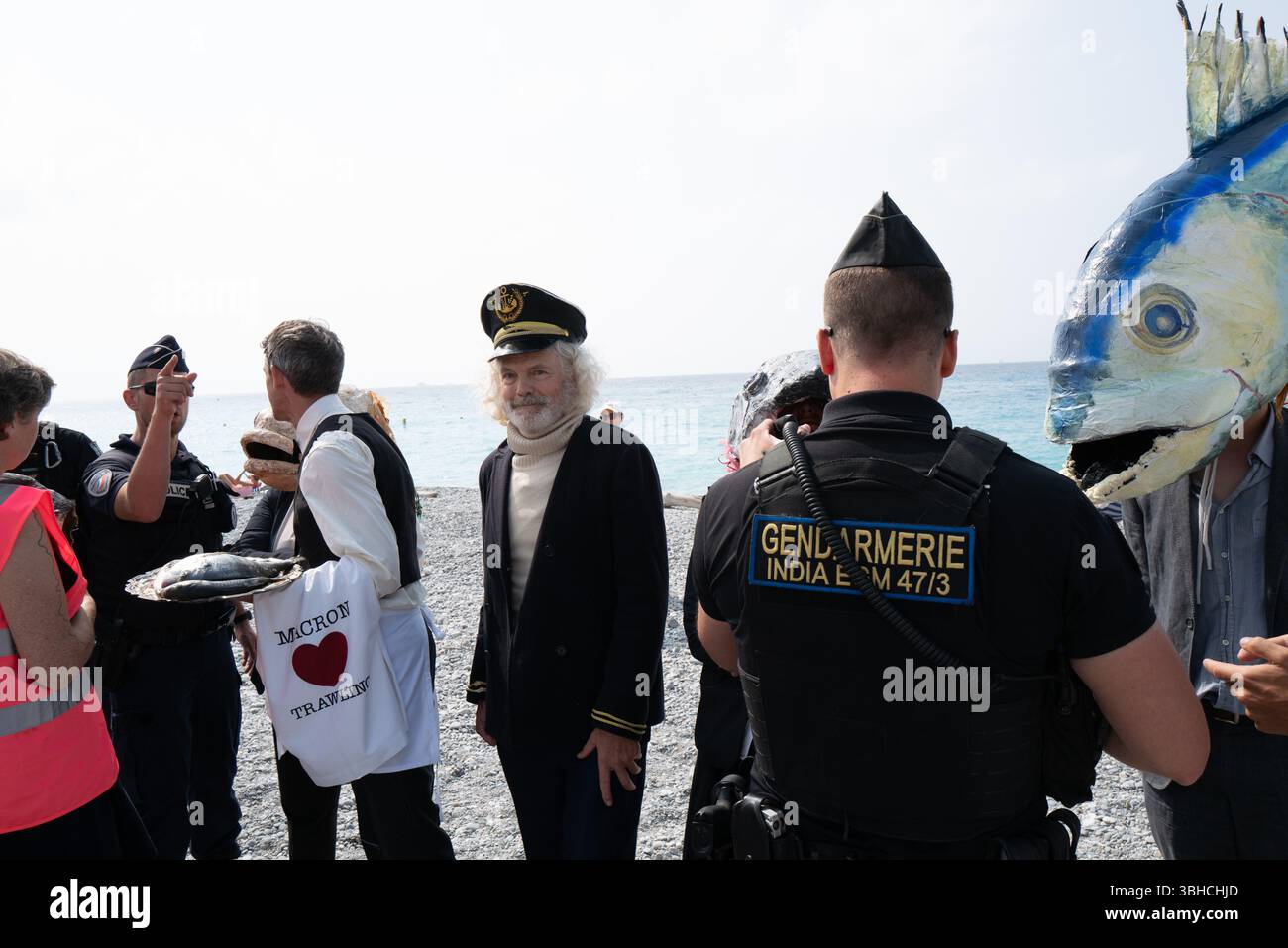 Activists from Ocean Rebellion stage a street theatre protest in Nice ...