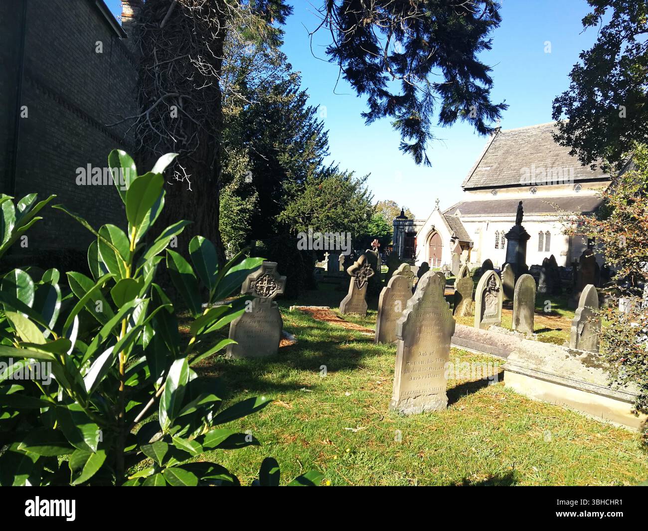 Historic Cemetery with Tombstones Beside a Medieval Church on a Sunny ...