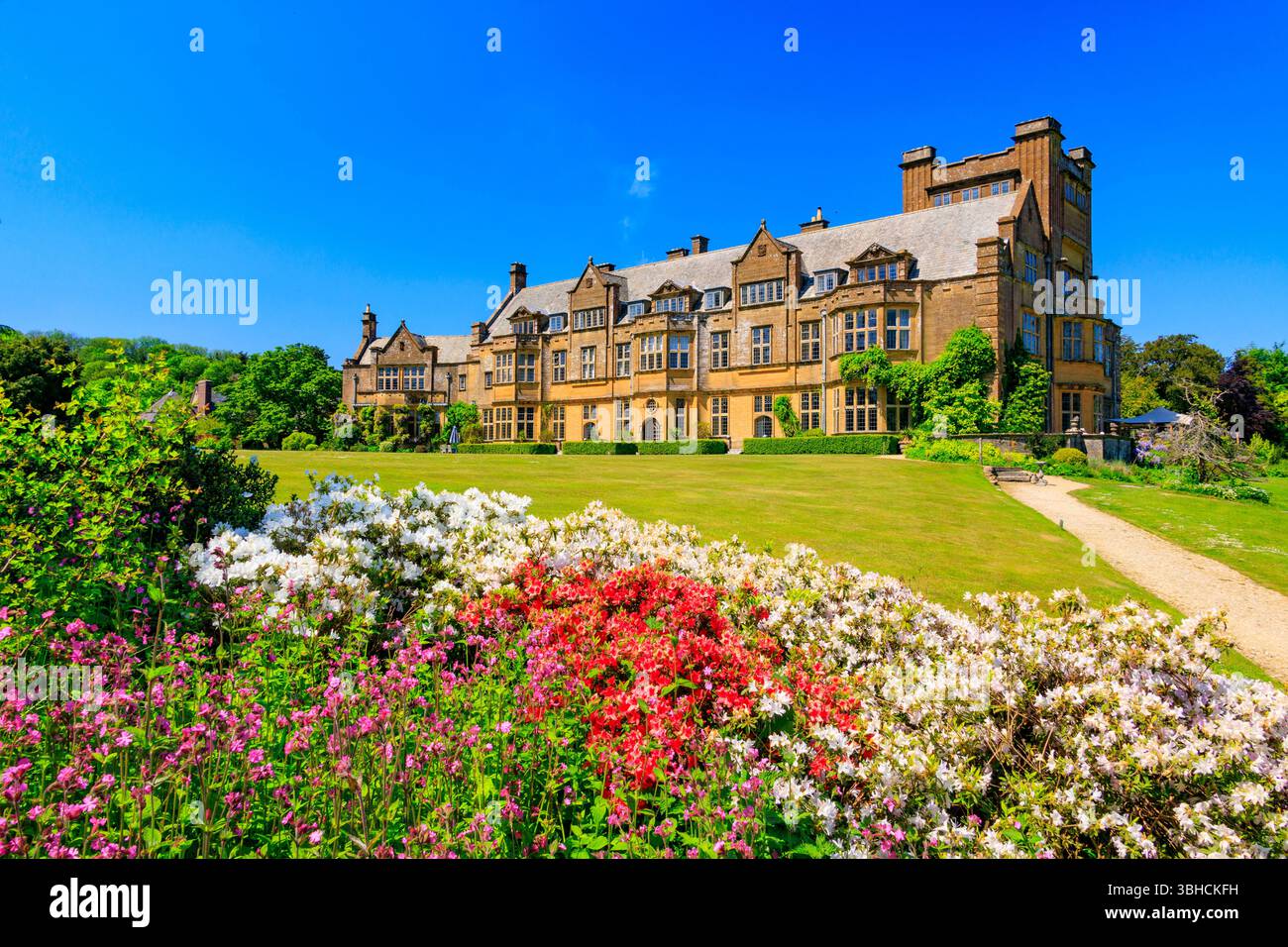 The elegant south front architecture of Minterne House with colourful ...