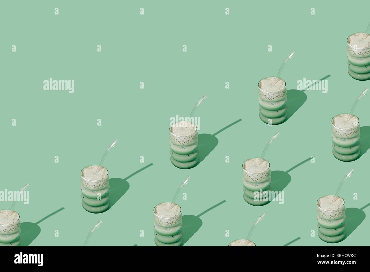 Creative summer pattern made of iced matcha latte on pastel green ...