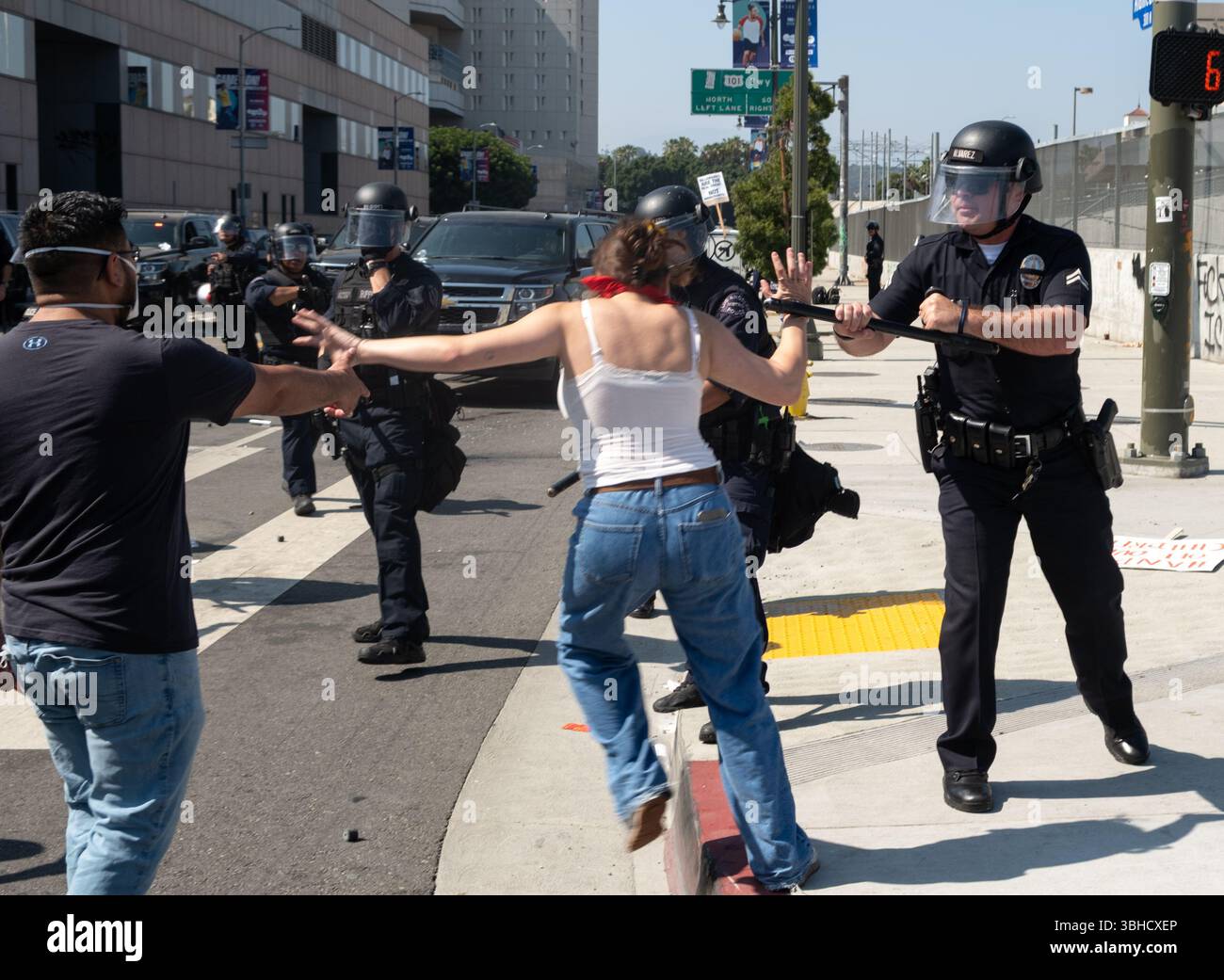 Los Angeles, USA. 08th June, 2025. LAPD officer pushes Anti-ICE ...