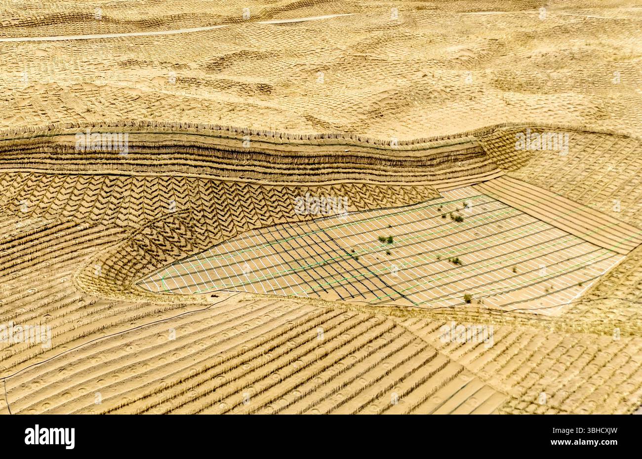 WUWEI, CHINA - JUNE 8, 2025 - Aerial view of the Qingtu Lake sandstorm ...