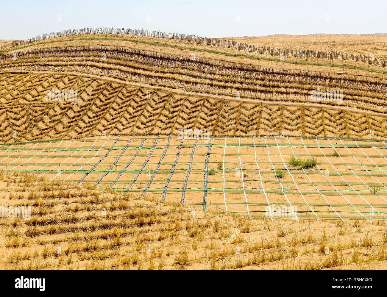 WUWEI, CHINA - JUNE 8, 2025 - Aerial view of the Qingtu Lake sandstorm ...