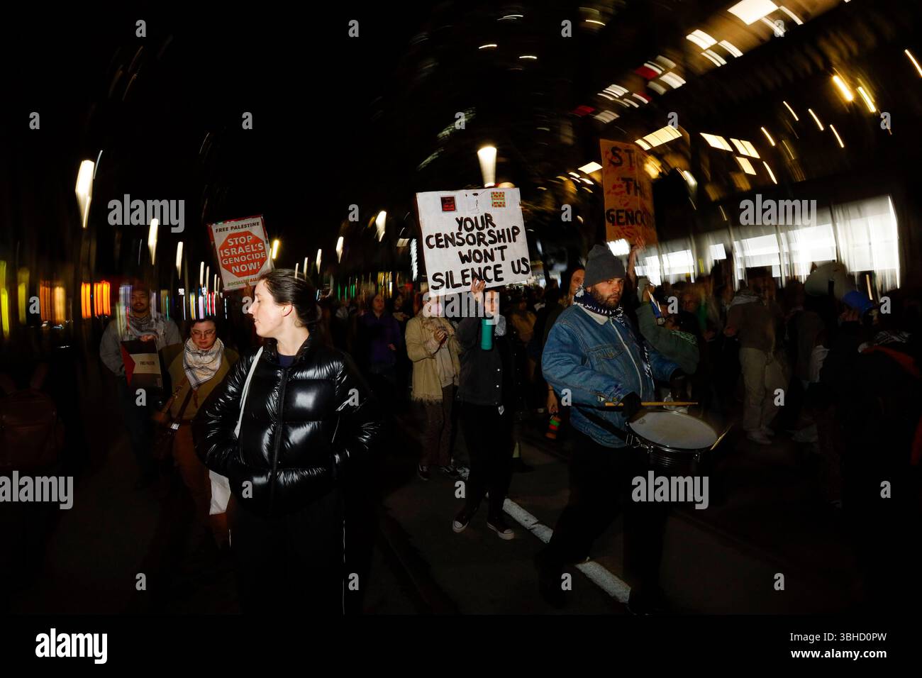 A protester holds a placard during the rally. Protesters gathered in ...