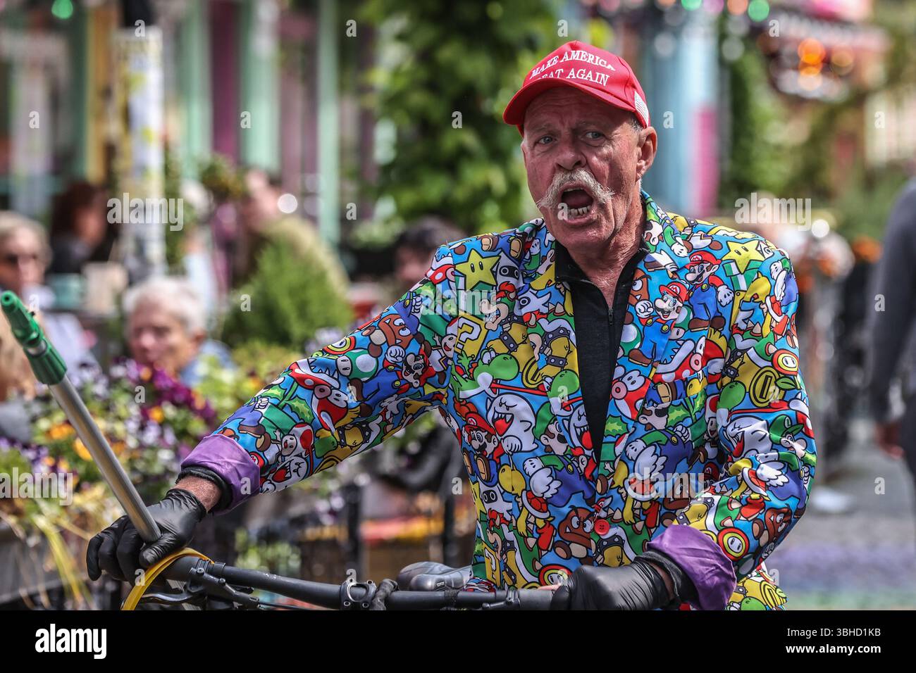 A President Donald trump supporter walks through the streets of ...