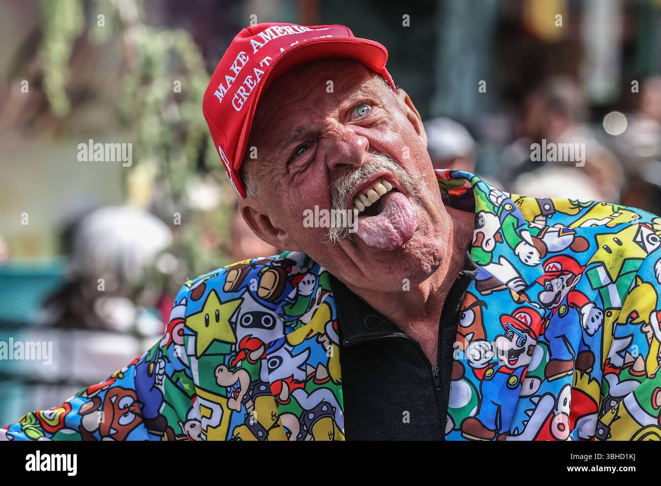 A President Donald trump supporter walks through the streets of ...