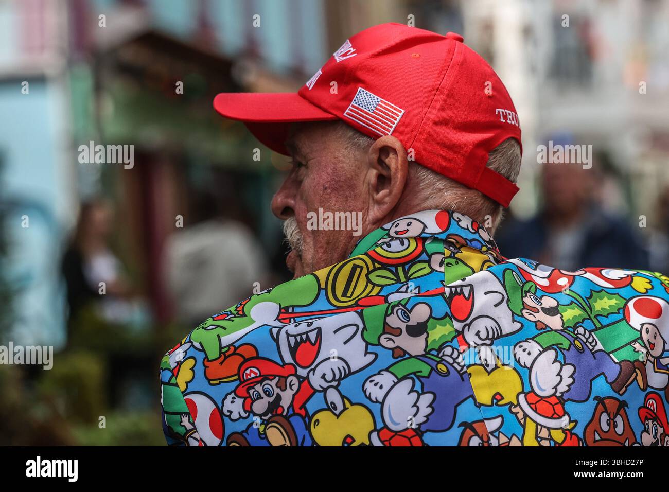 A President Donald trump supporter walks through the streets of ...