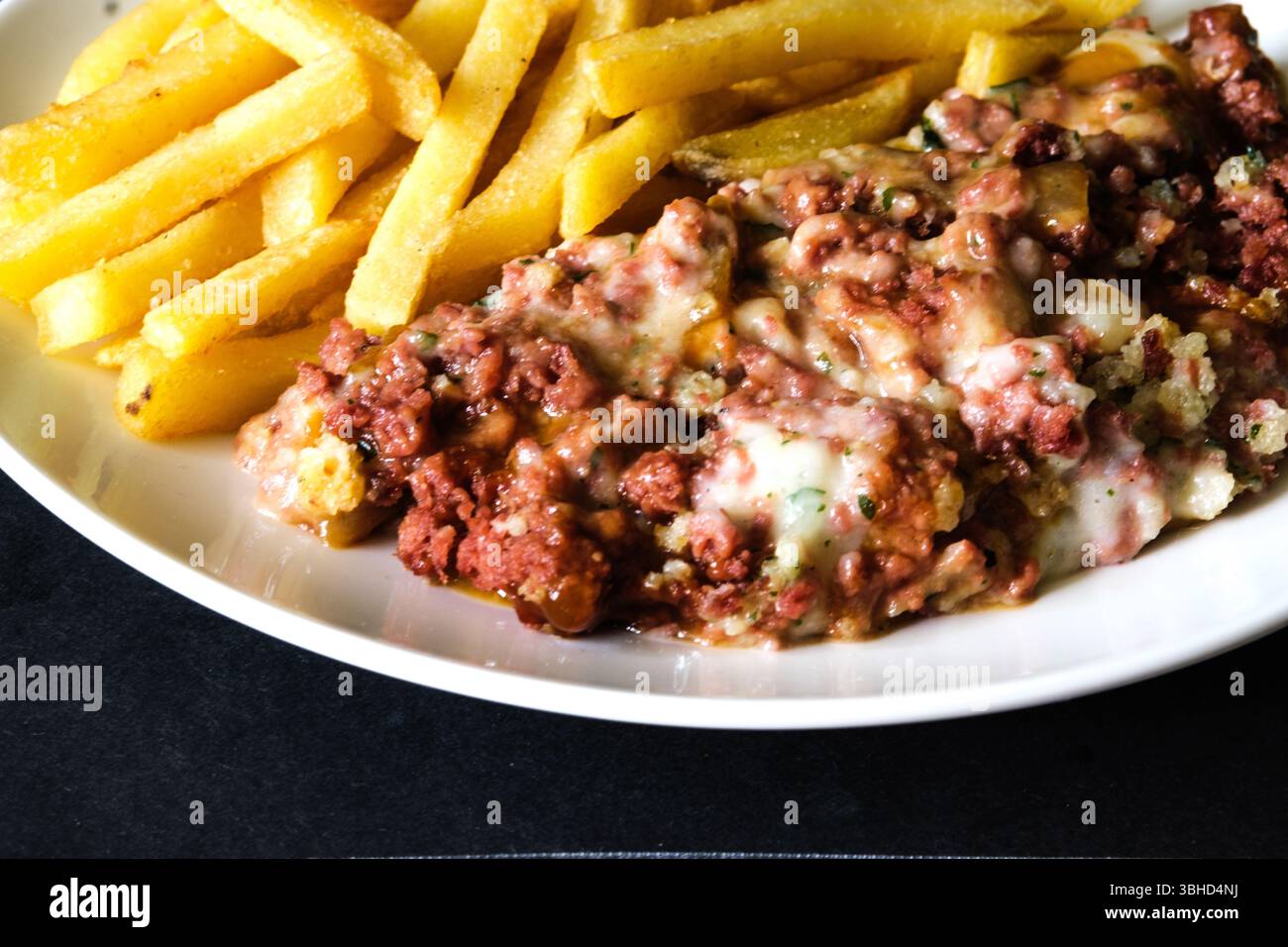 London UK, June 09 2025, Classic Meal Of Corned Beef Hash and Chips ...