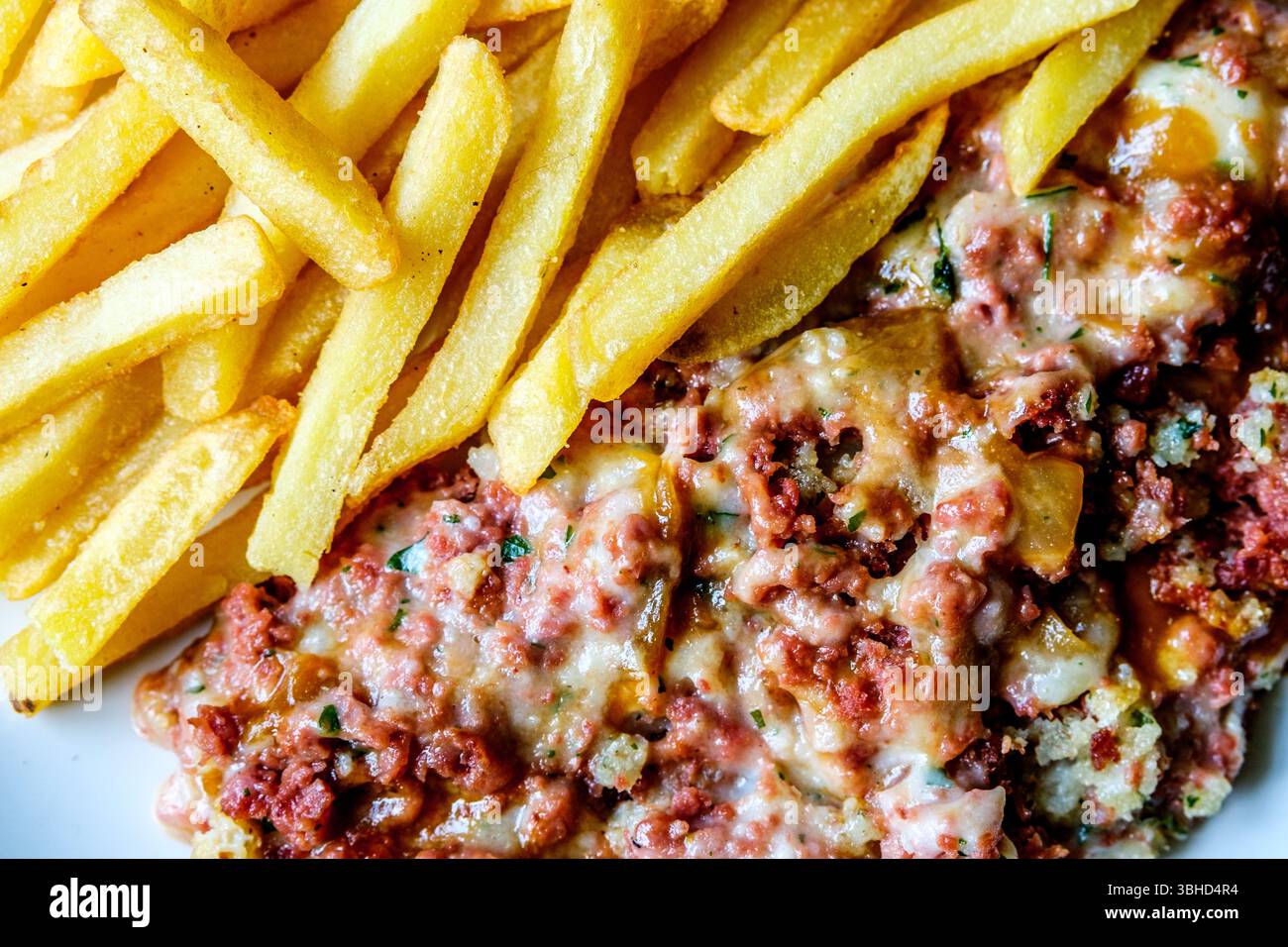 London UK, June 09 2025, Classic Meal Of Corned Beef Hash and Chips ...