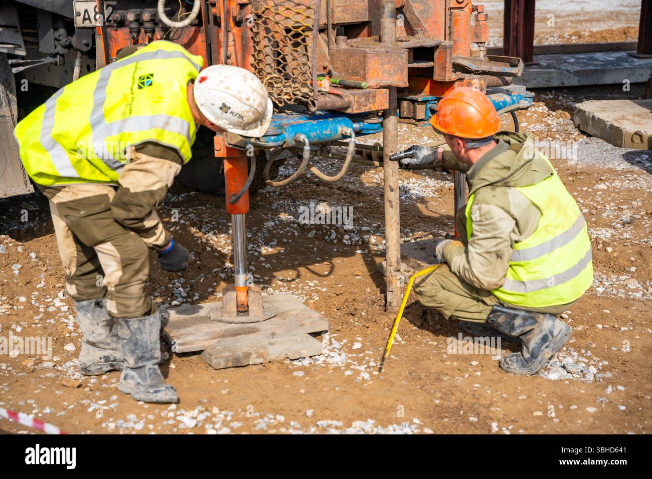 Belovo, Russia - May 18, 2025: Close-up of soil sampling during pile ...