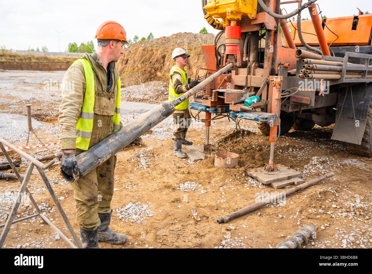 Belovo, Russia - May 18, 2025: Close-up of soil sampling during pile ...