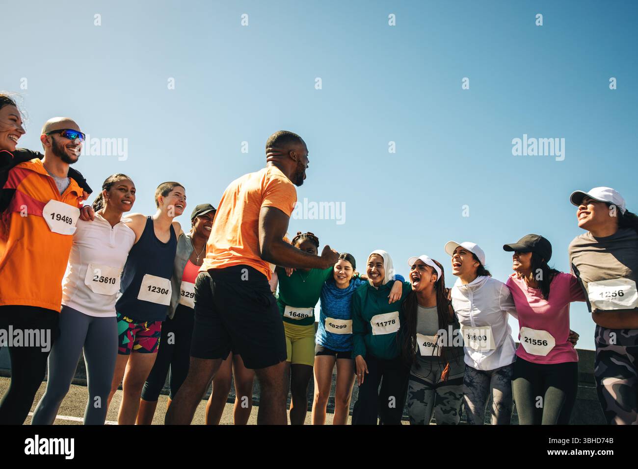 A diverse group of runners gathered for an energizing pep talk. The ...