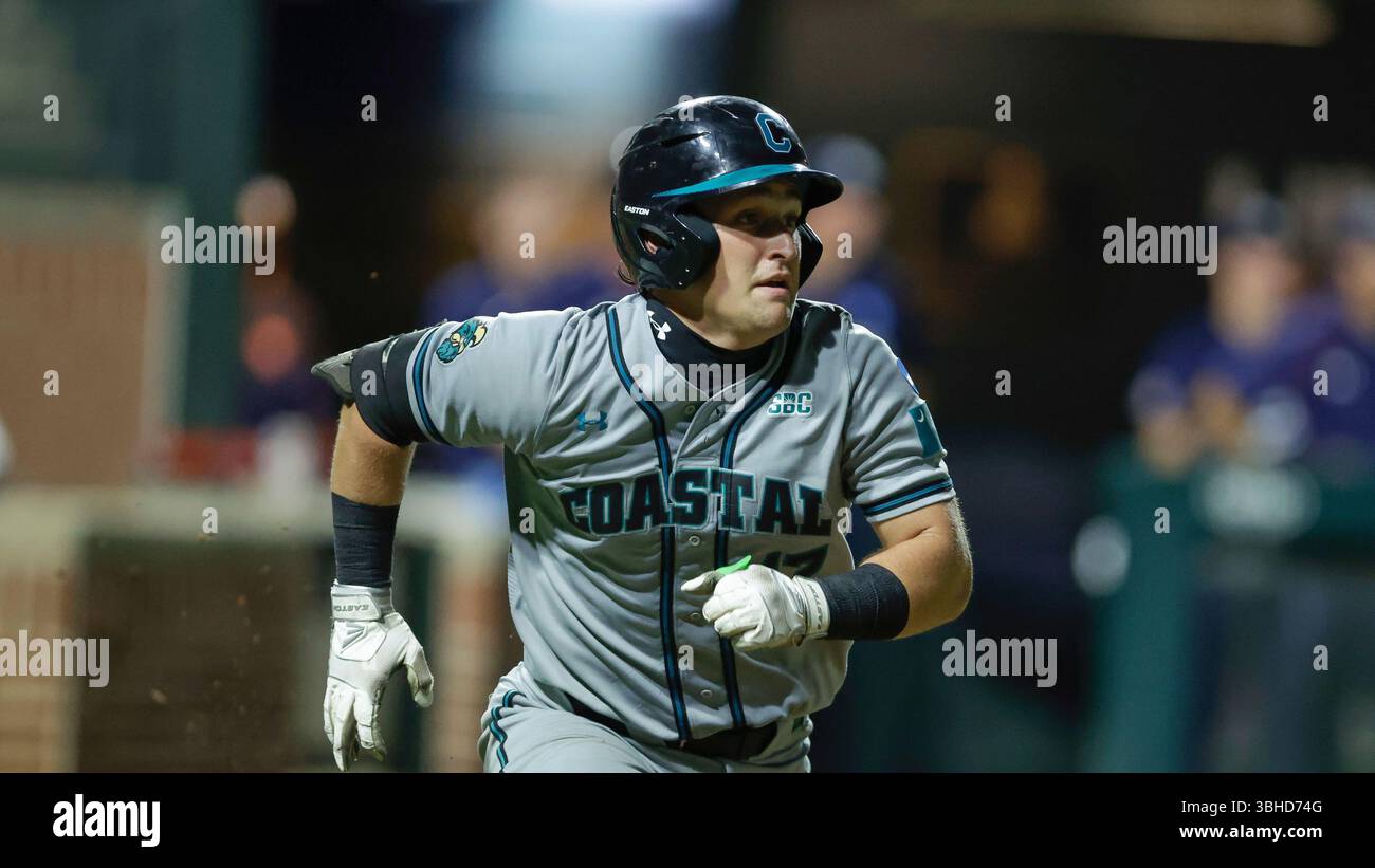 Coastal Carolina's Caden Bodine (17) hits a solo home run during an ...