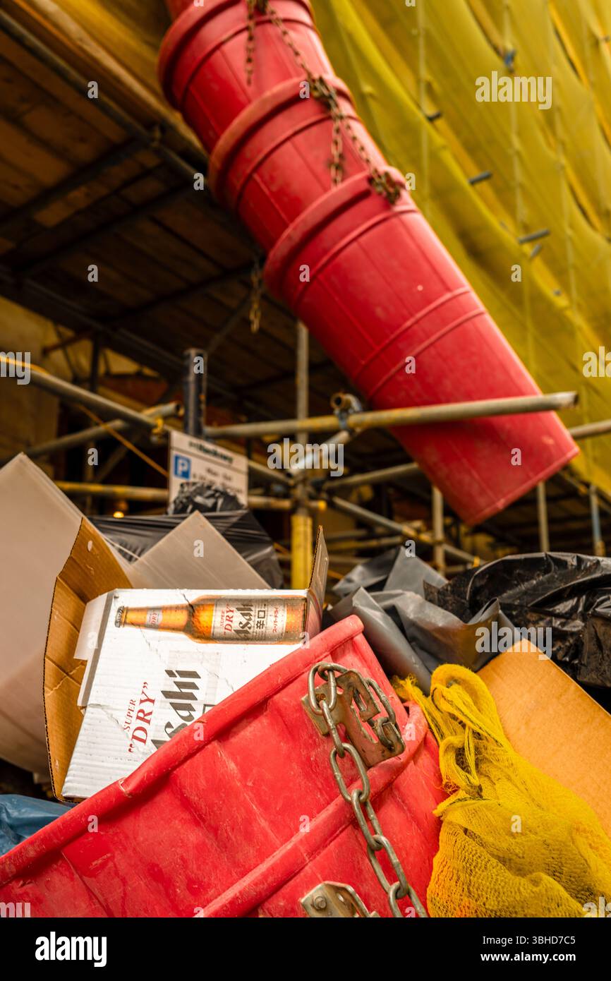 rubbish chute, scaffolding , Skip with bucket shoot Orange and Yellow ...