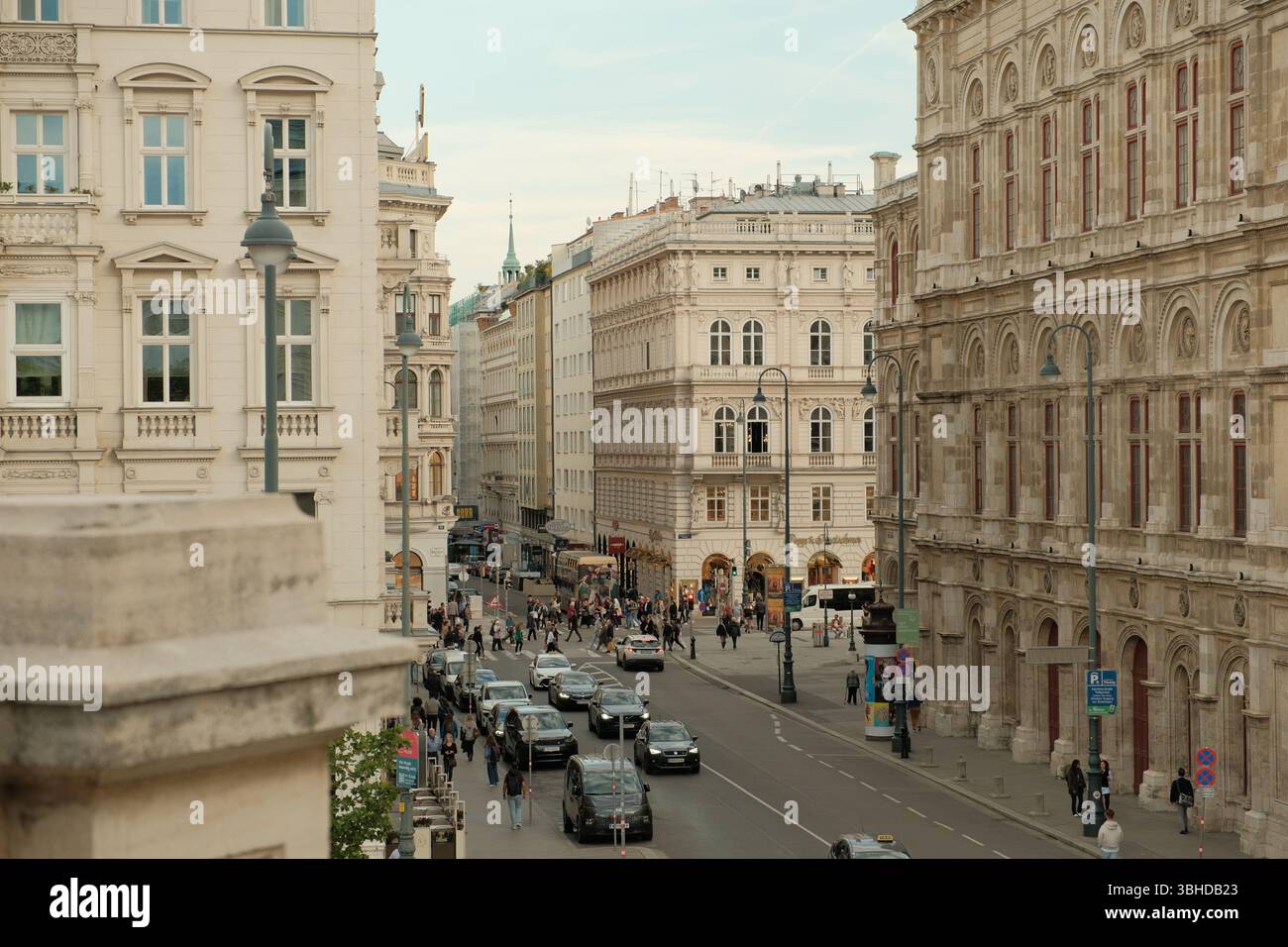 Elegant historic architecture lines a lively city street in central ...