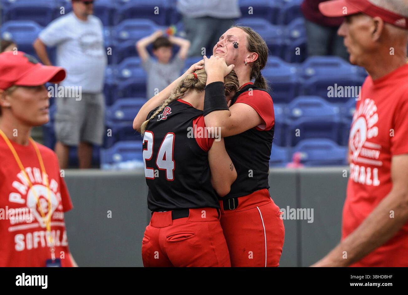 Daviess County's Sadie Morris (24) is consoled by teammate Kamryn ...