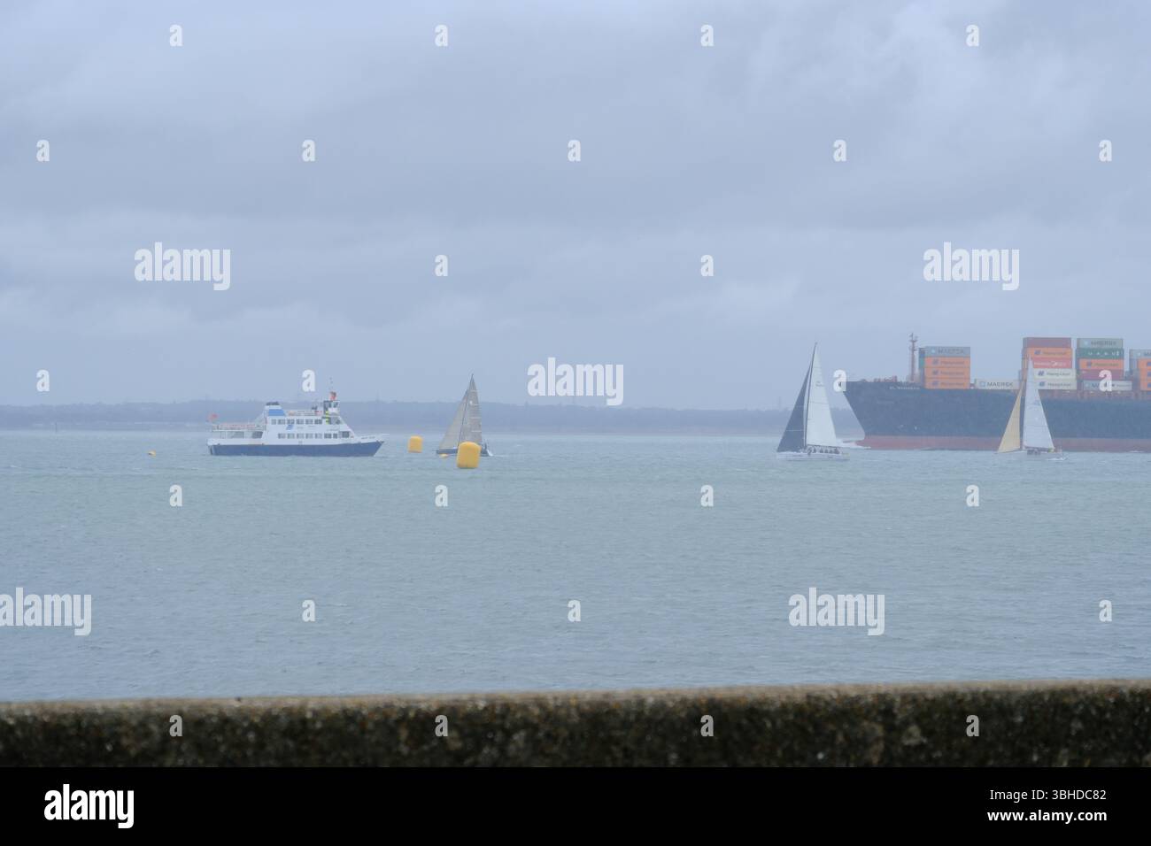 7 JUN 2025 - Cowes, UK - Yachts approaching the finish line at Cowes ...